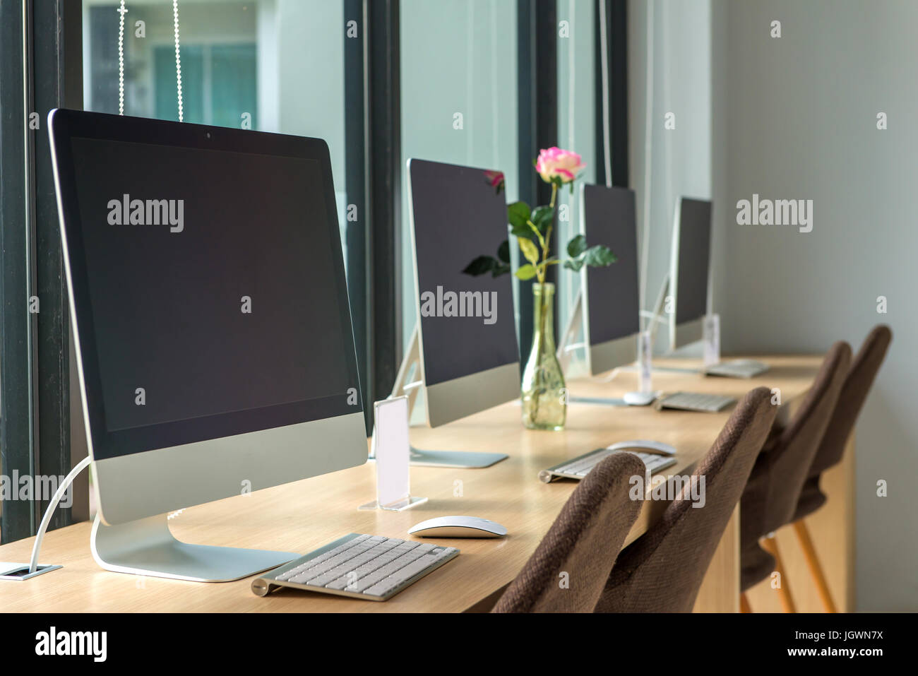 computer desktop with keyboard, diary and other accessories on table in ...