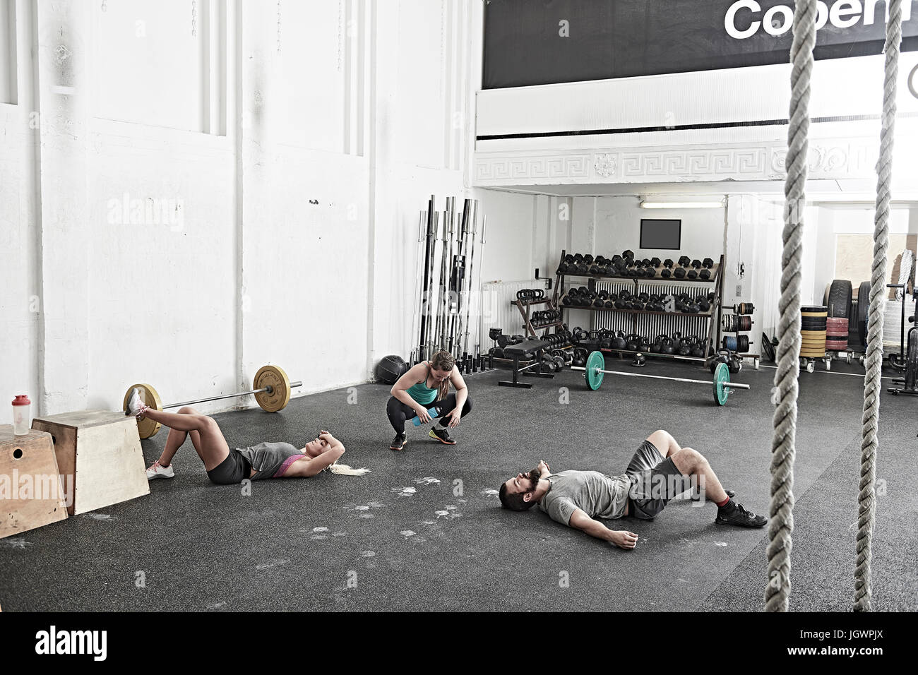 Woman lying on back training legs hi-res stock photography and images ...