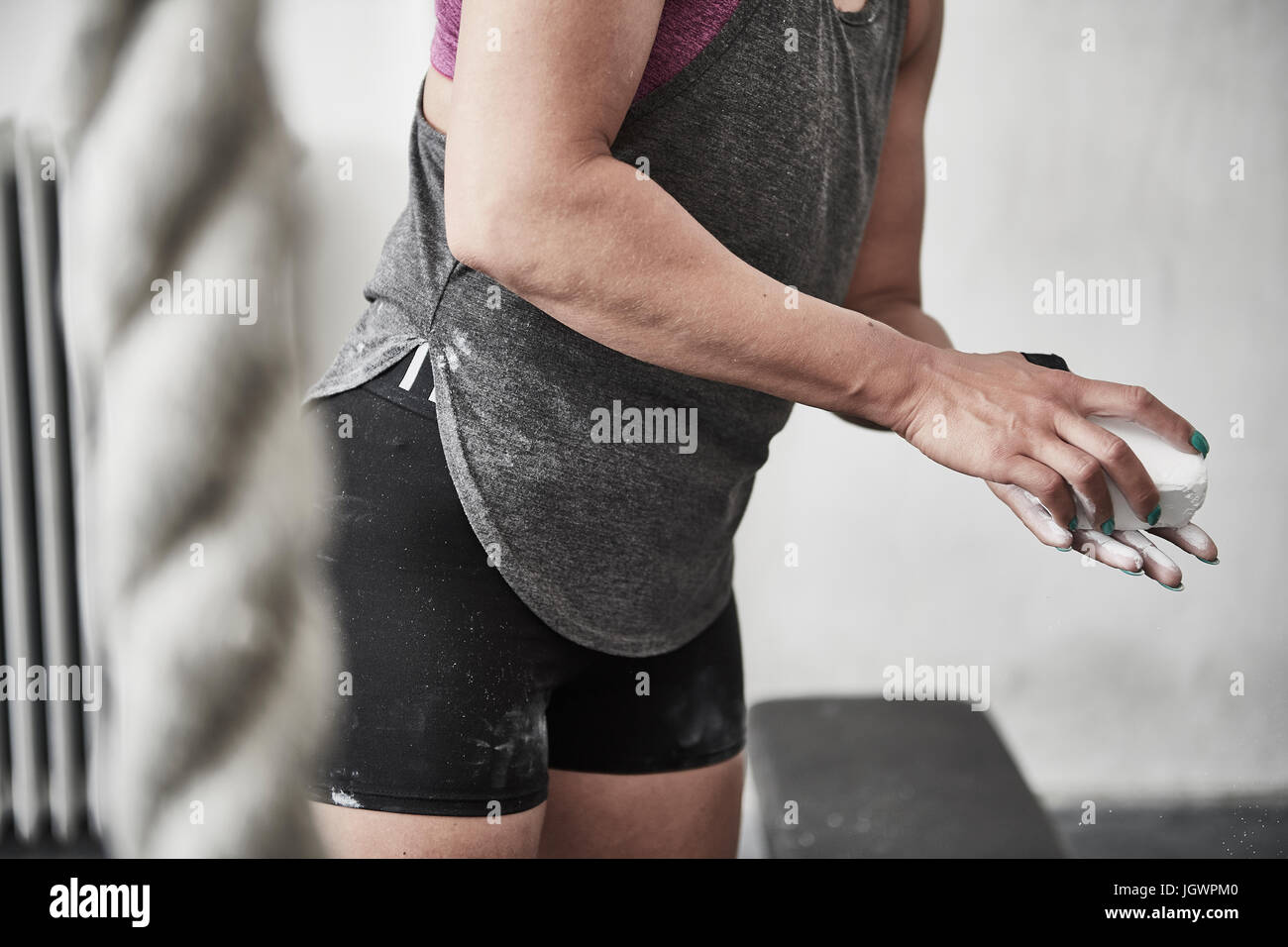 Woman chalking hand Stock Photo - Alamy