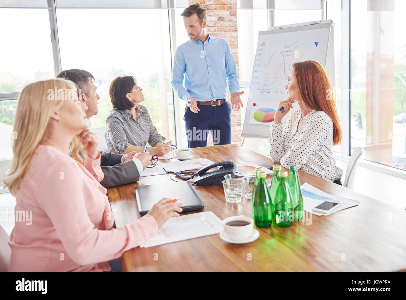 Young woman leading business hi-res stock photography and images - Alamy