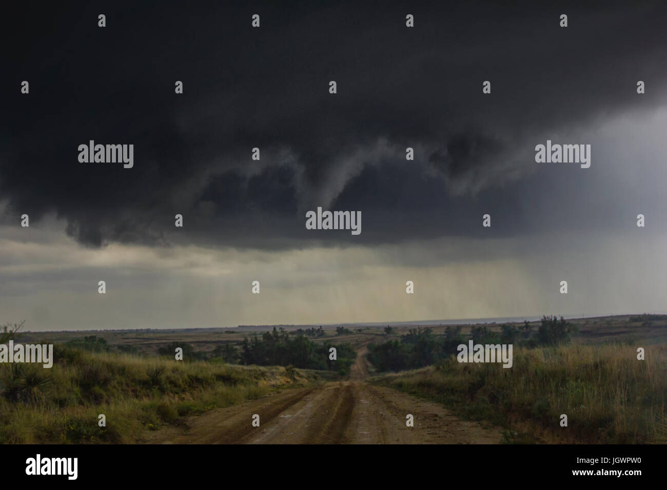 Rotating funnel cloud over rural road, McLean, Texas, United States ...
