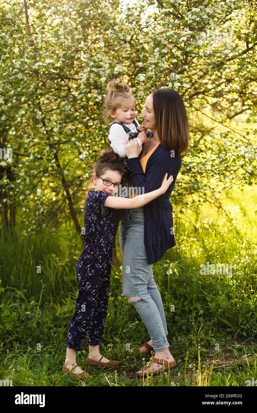 Mother, and, two, daughters, tree hi-res stock photography and images ...