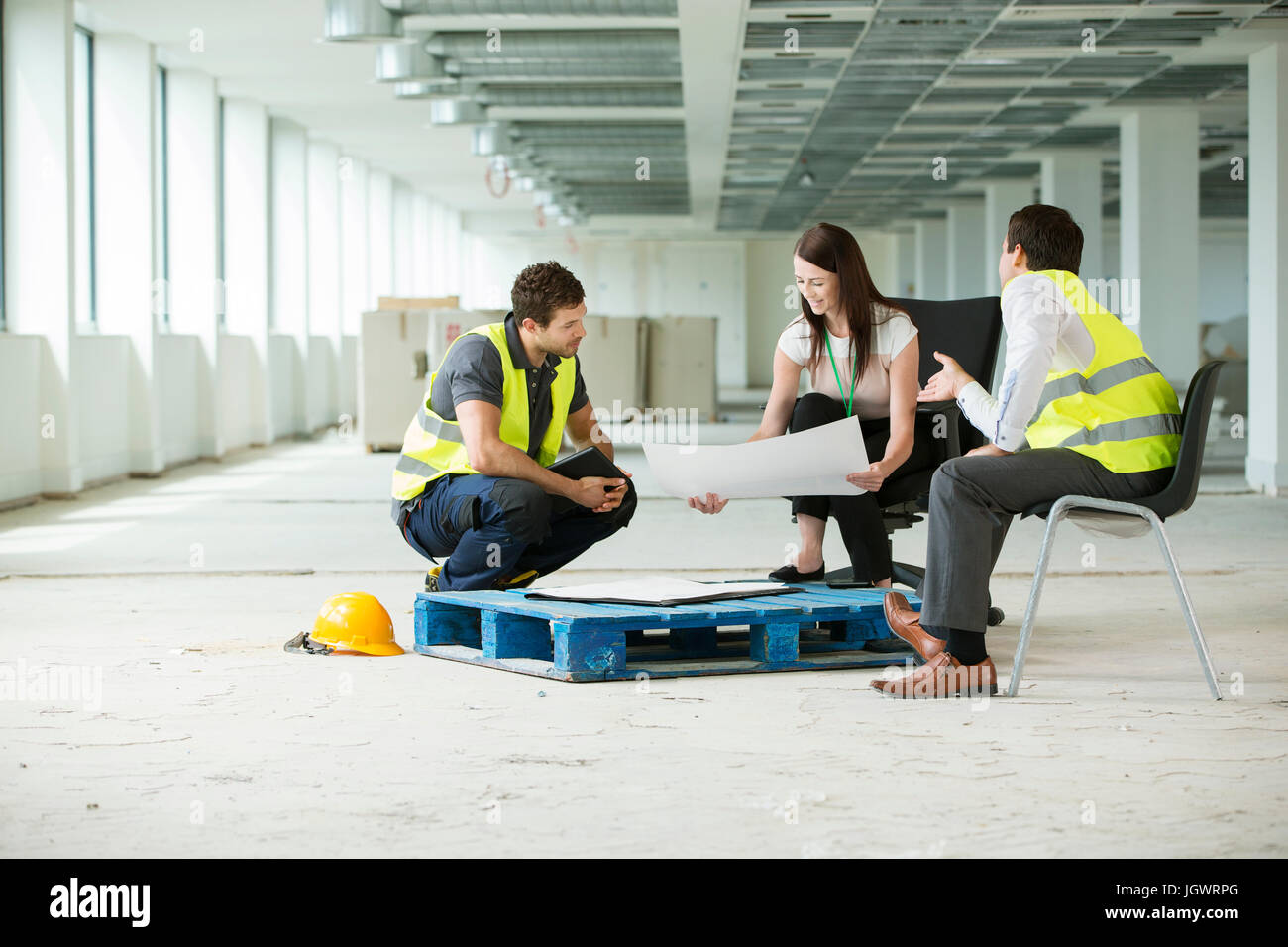 Construction holding building plans hi-res stock photography and images ...