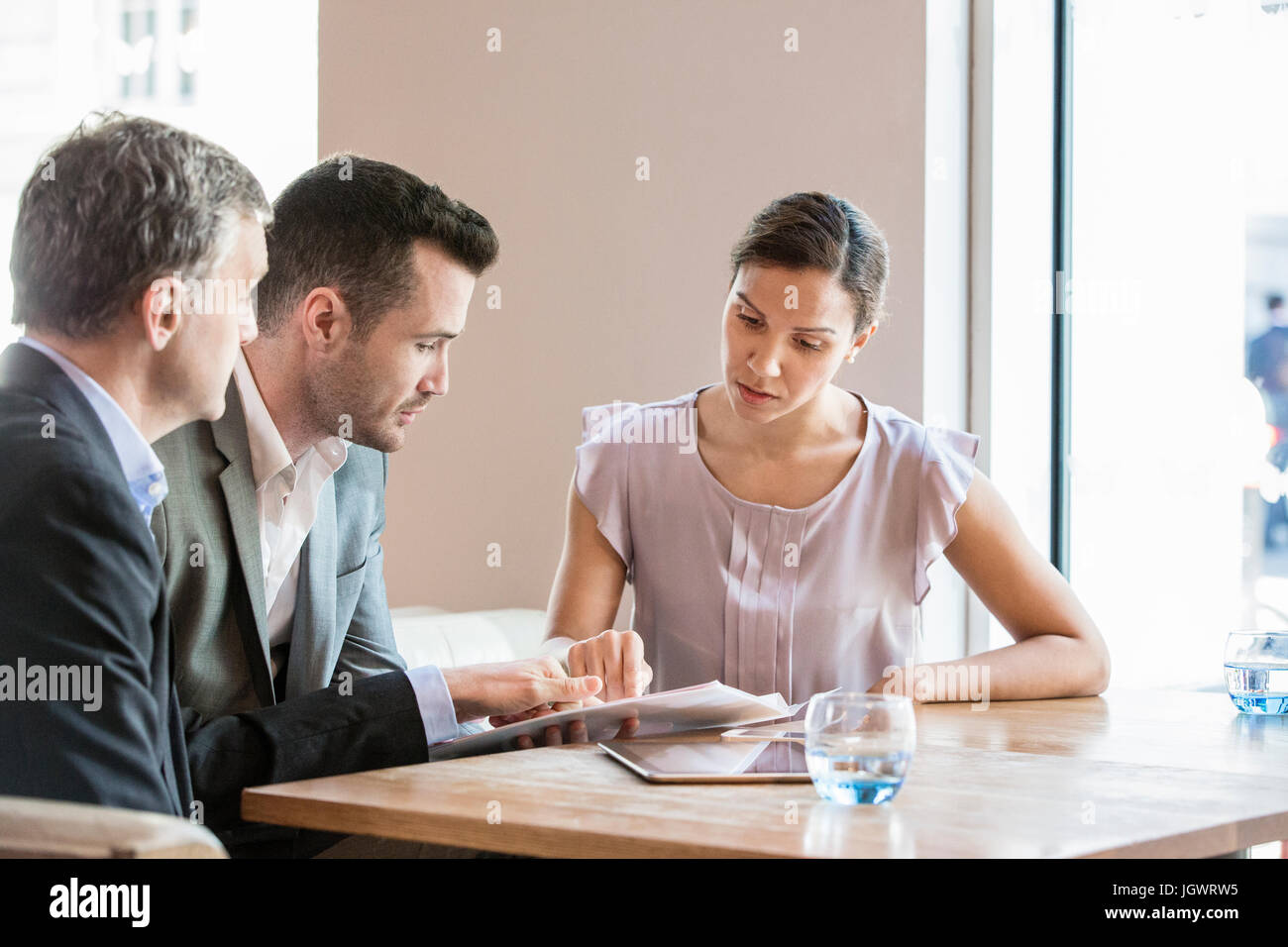 Businessmen and businesswoman working Stock Photo - Alamy
