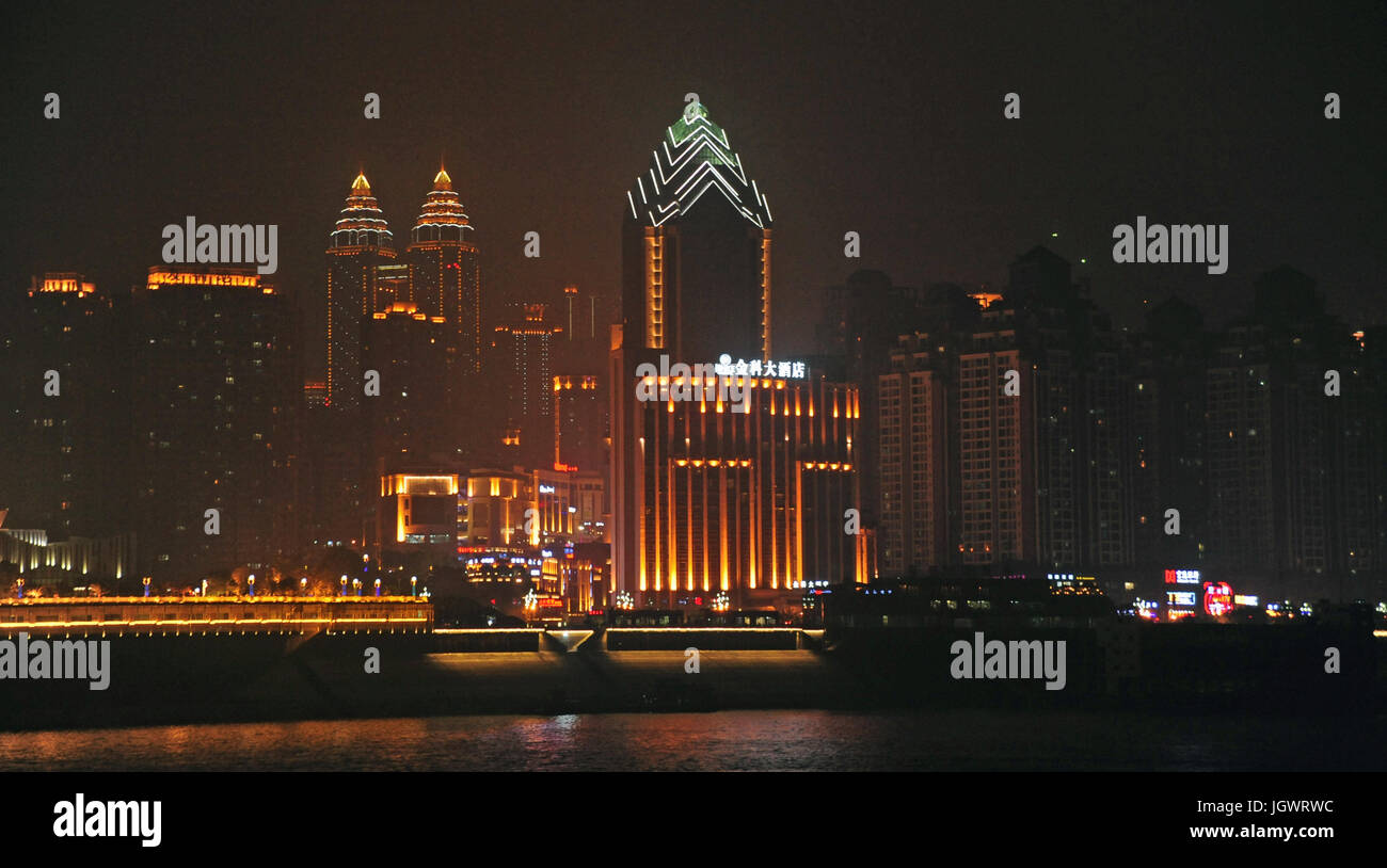 View of illuminated high-rise buildings on the Yangtze river in the ...