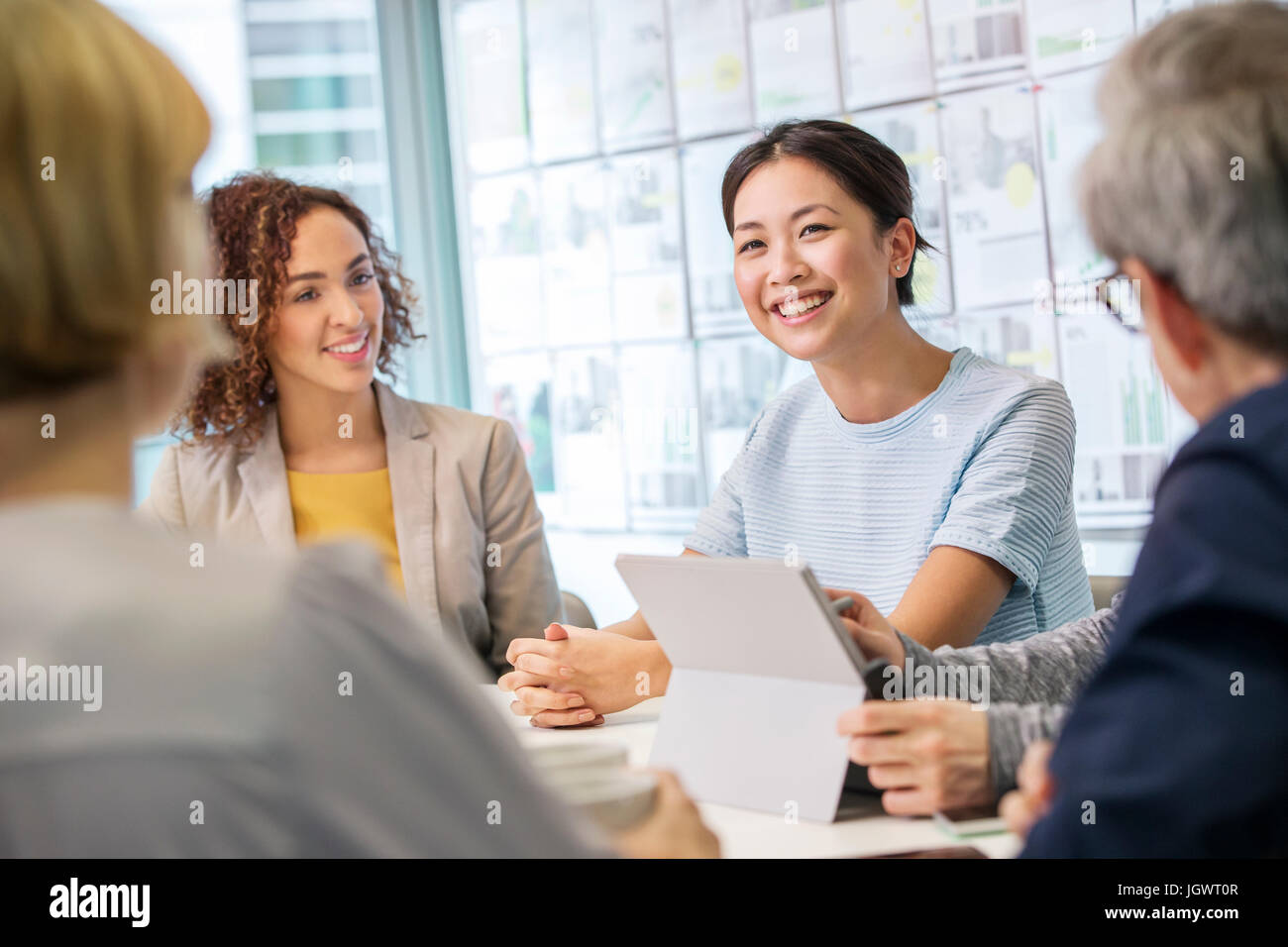 Digital design team discussing ideas at conference table Stock Photo ...