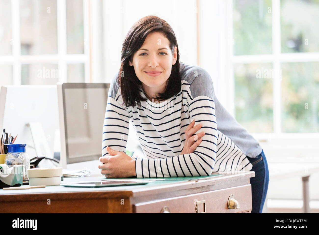 Woman leaning forward in studio hi-res stock photography and images - Alamy