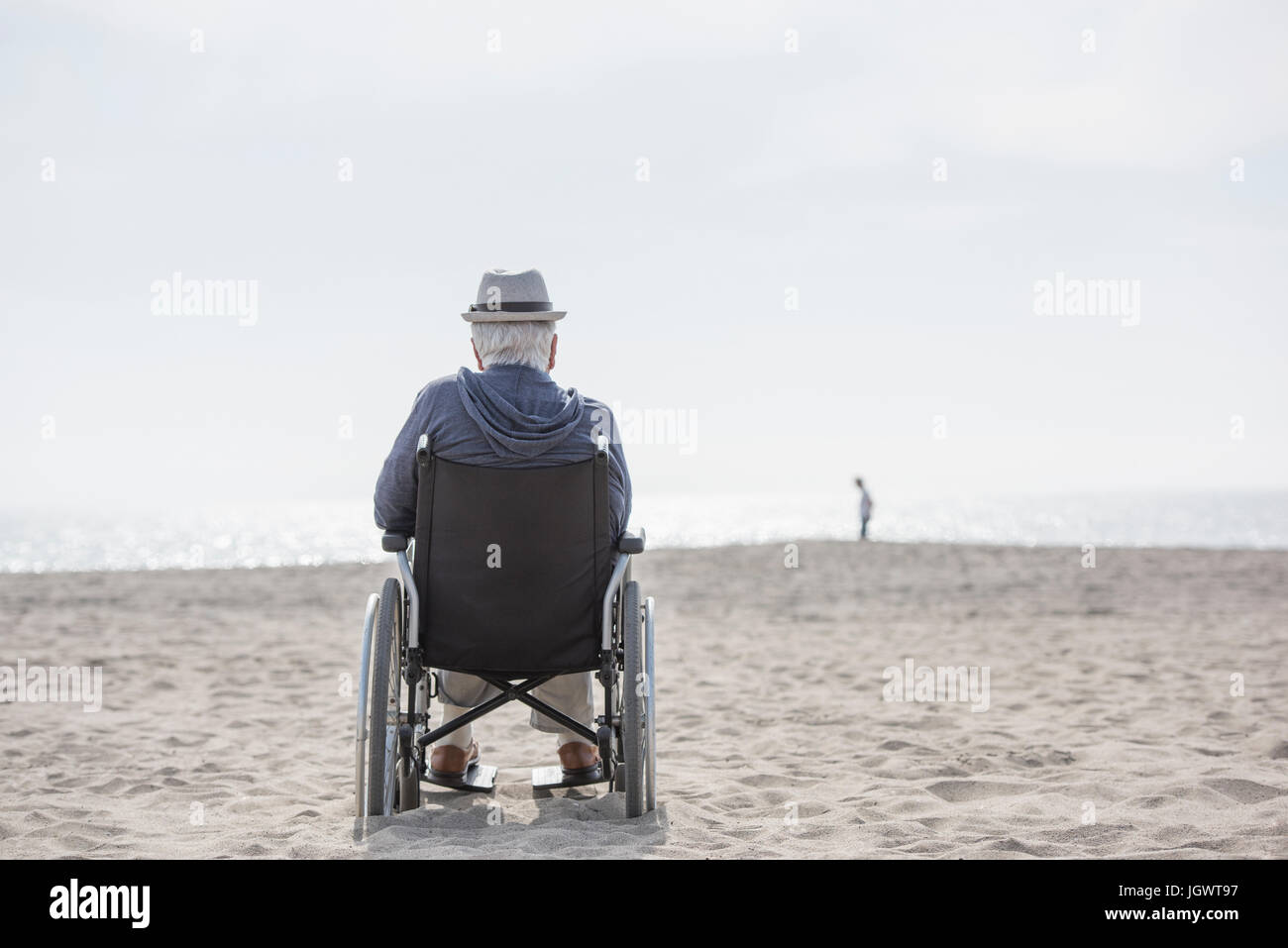 Man wheelchair rear view hi-res stock photography and images - Alamy