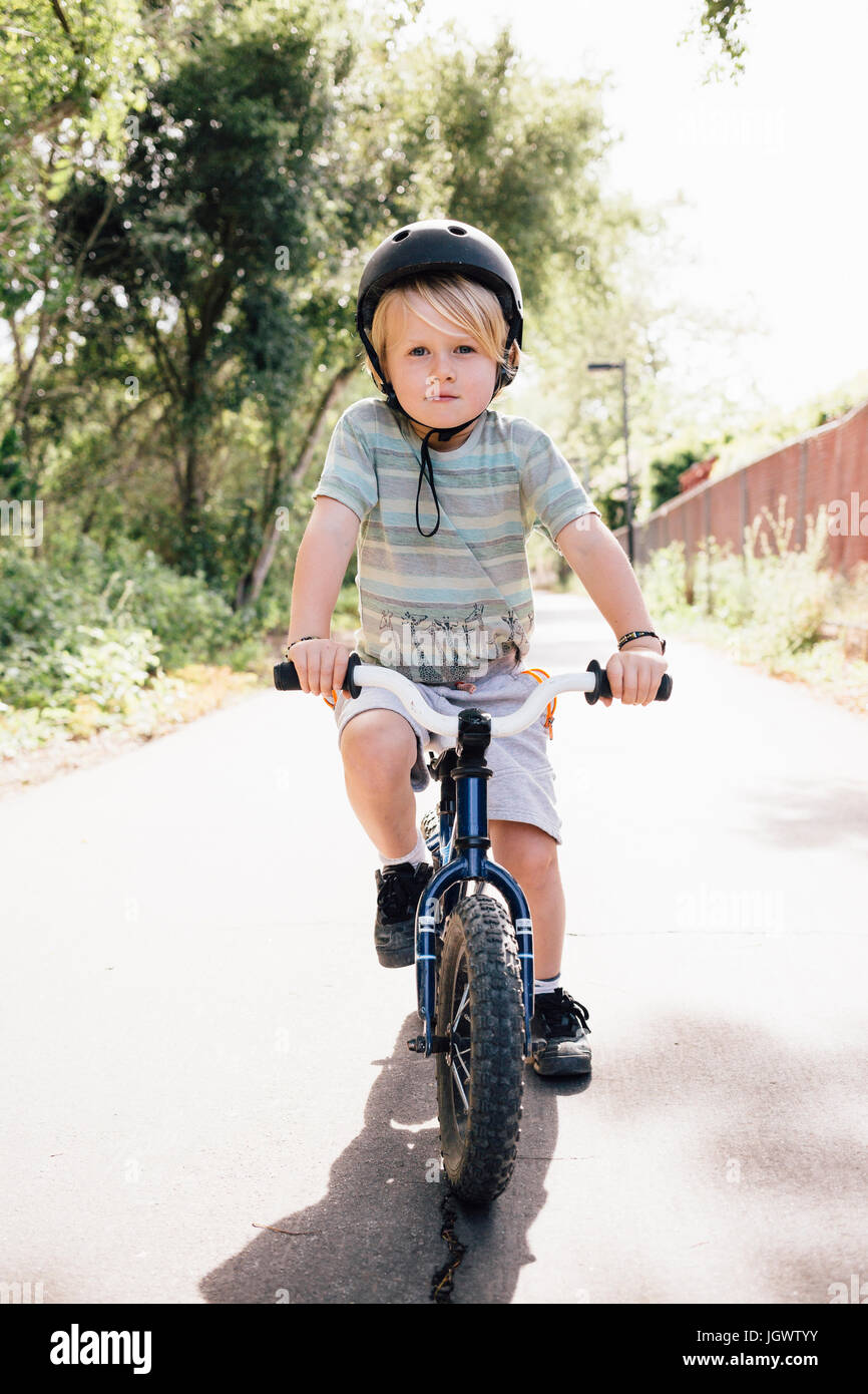 Boy riding bicycle hi-res stock photography and images - Alamy