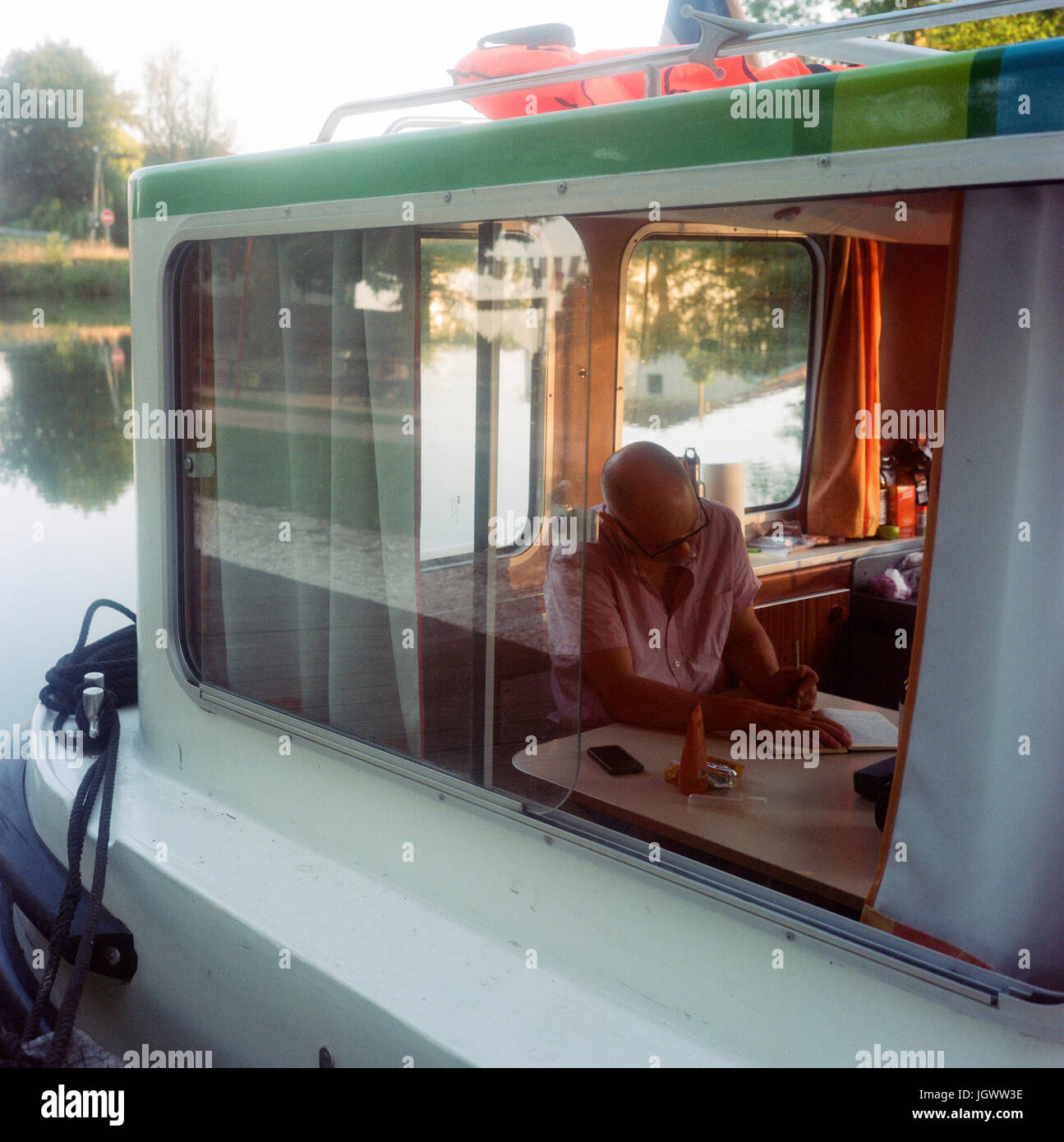 Man on barge hi-res stock photography and images - Alamy