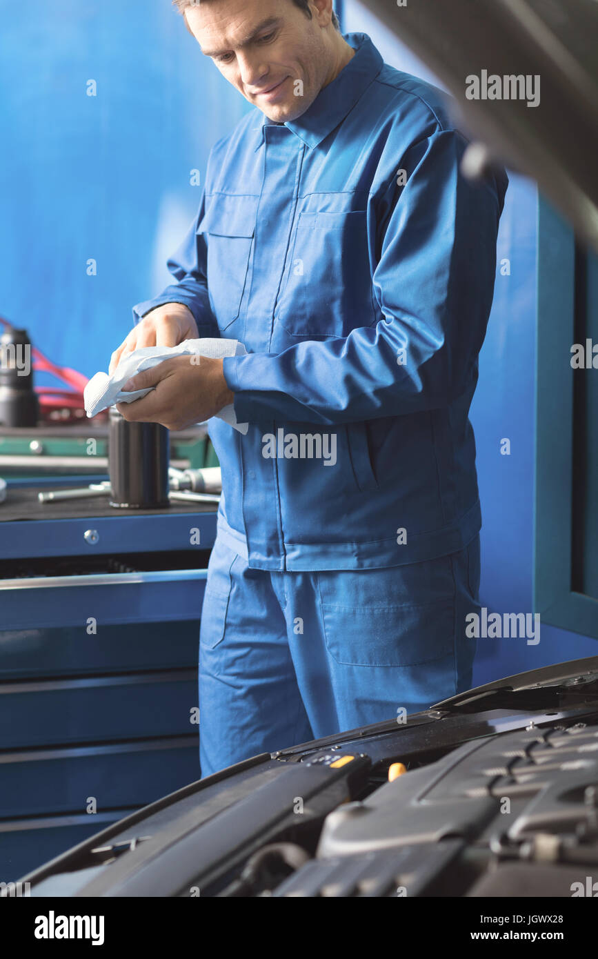 Finishing the day. Reliable skilled local tinker cleaning his hands ...