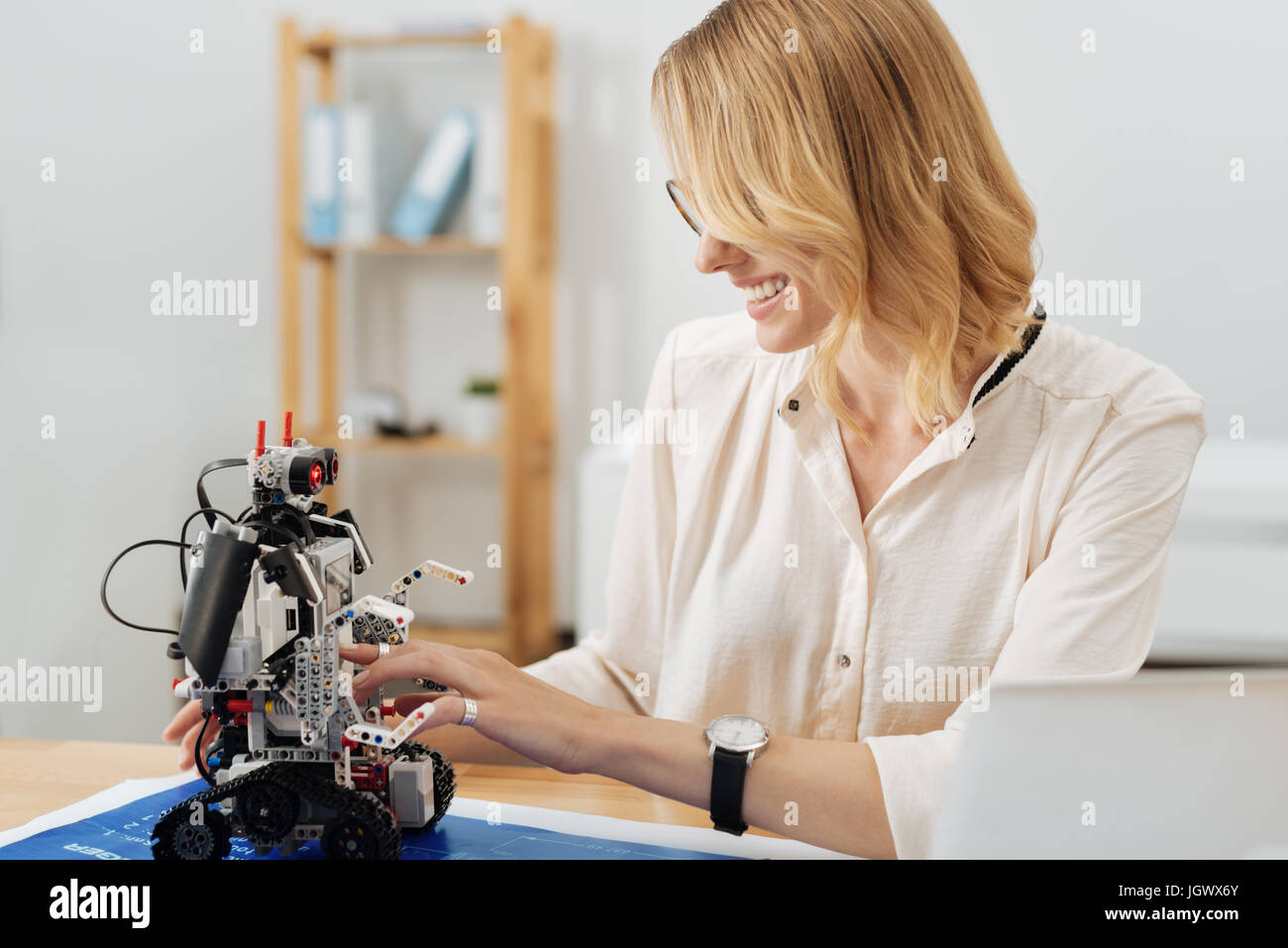 Enjoying my invention. Overwhelmed friendly smart inventor working on ...