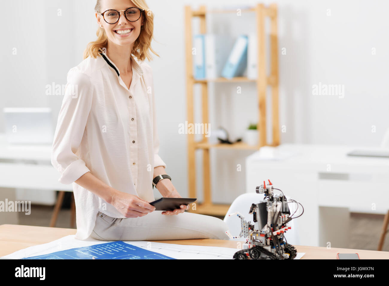 Full of happy emotions. Cheerful intelligent skillful engineer working ...