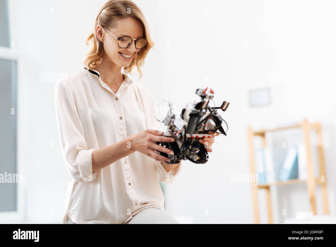 Time for tech check up. Clever cute concentrated technology specialist ...