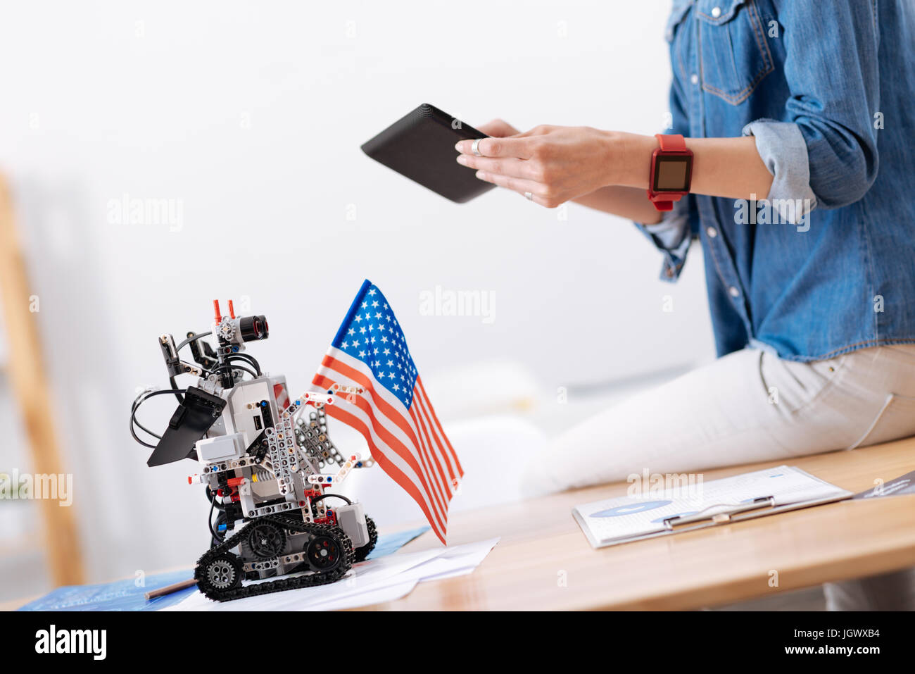 Typical American workplace of the future. Skillful young involved woman ...