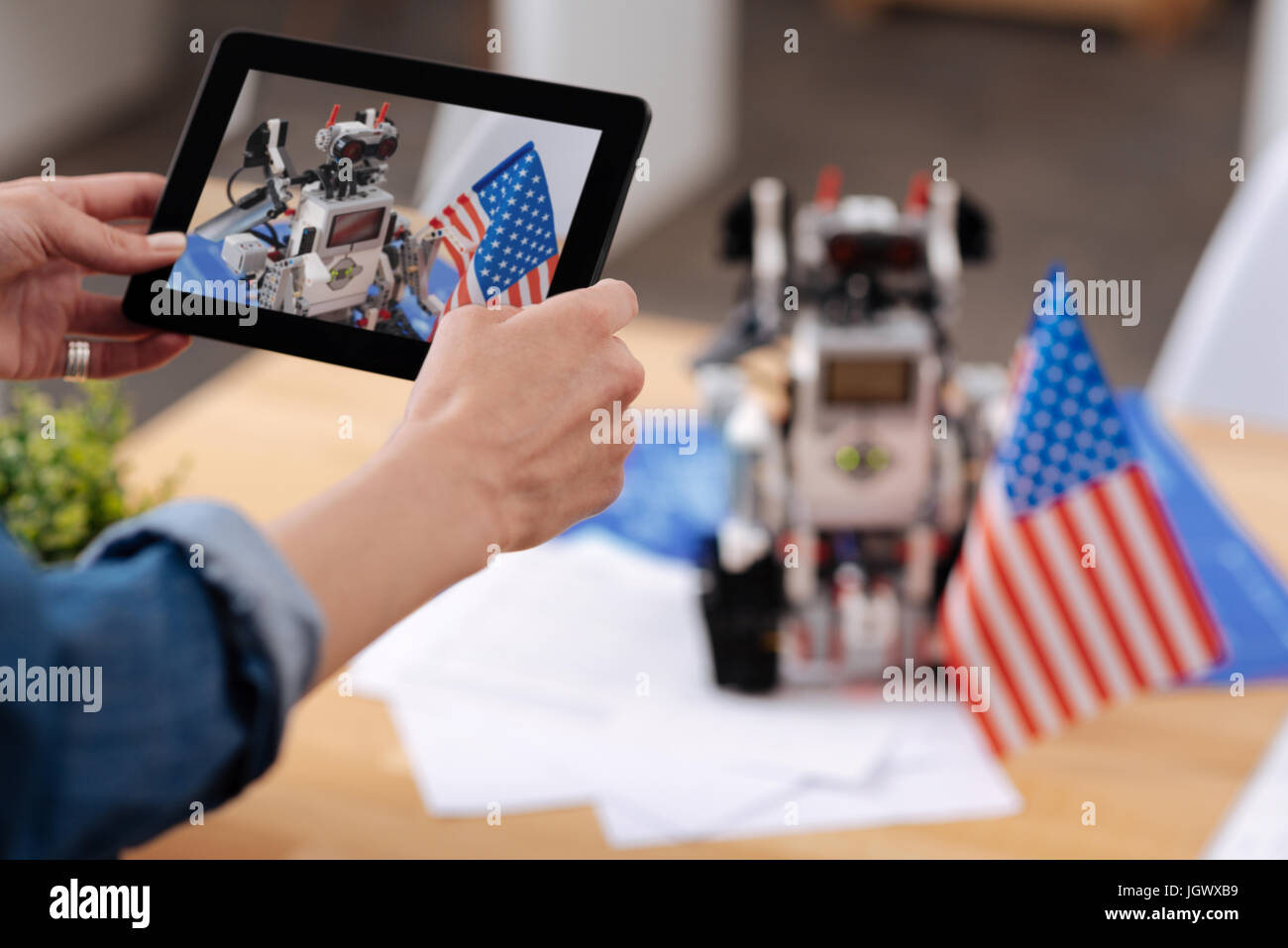 Proud inventor of new robot system. Intelligent young professional ...