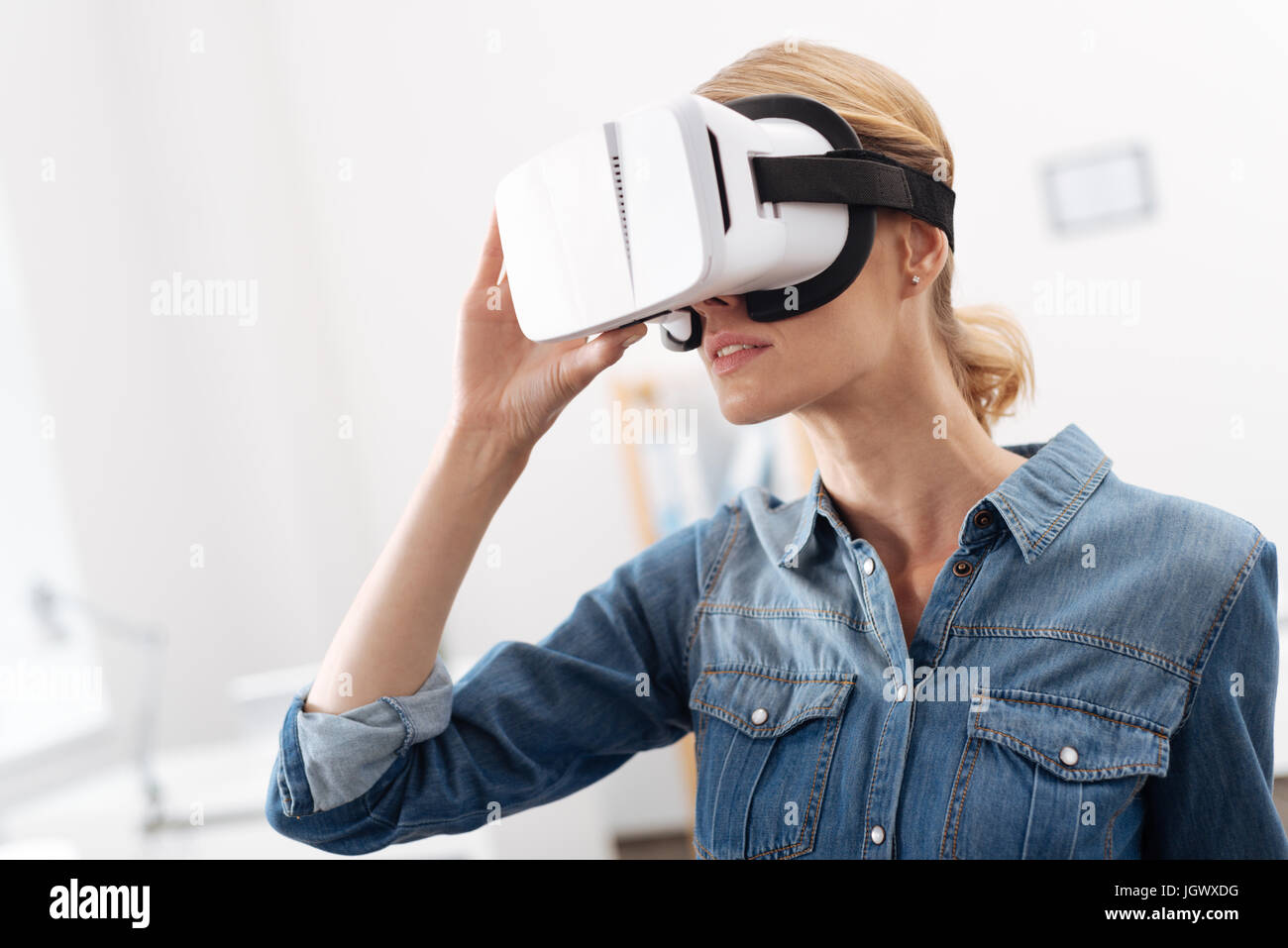Serious young woman in vr hi-res stock photography and images - Alamy