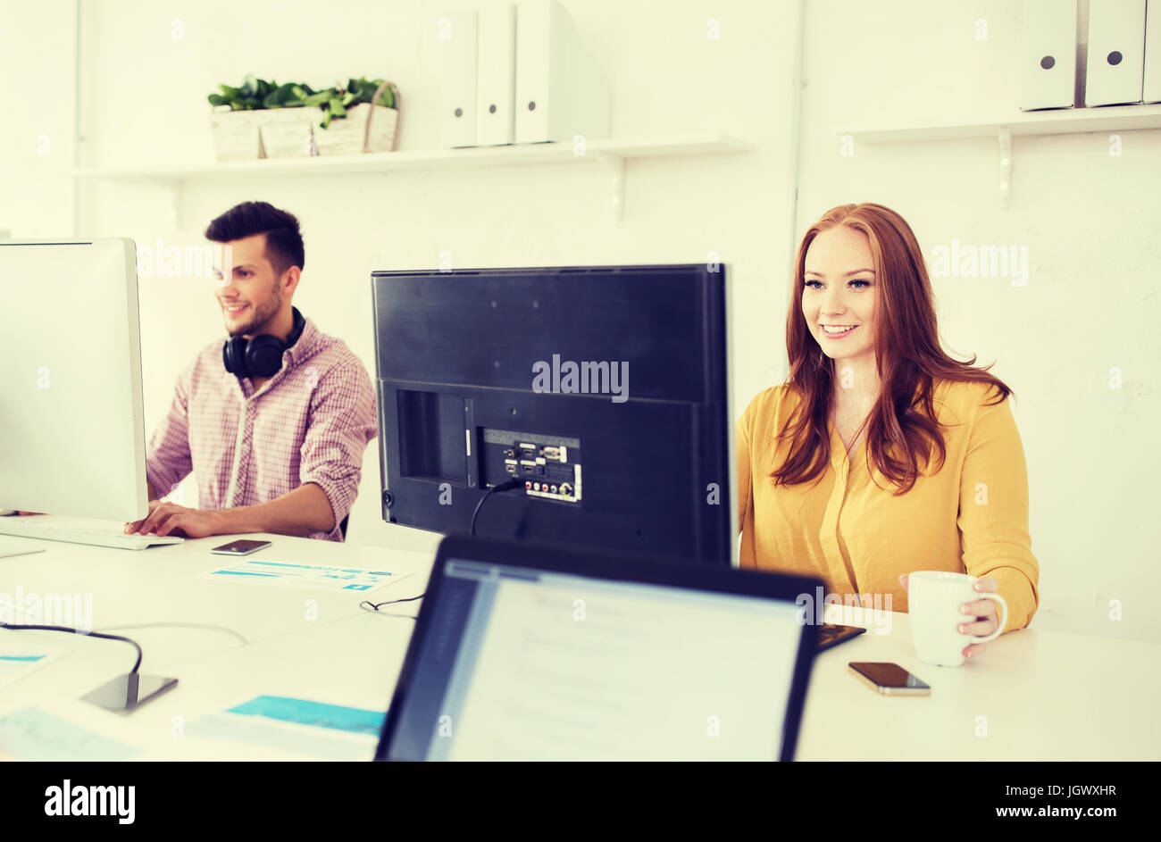 creative team with computers working at office Stock Photo - Alamy