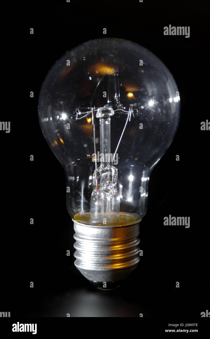 Classic electric bulb on black background. Old lightbulb Stock Photo ...