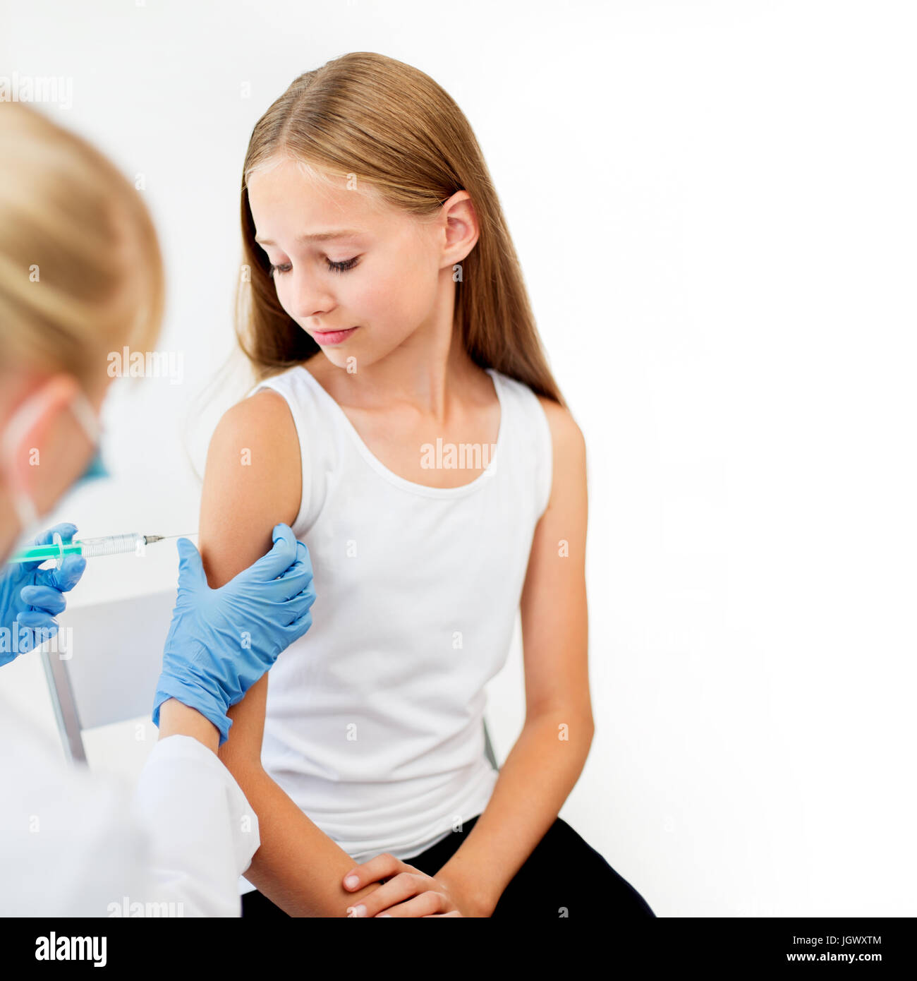 doctor with syringe making injection to girl Stock Photo - Alamy