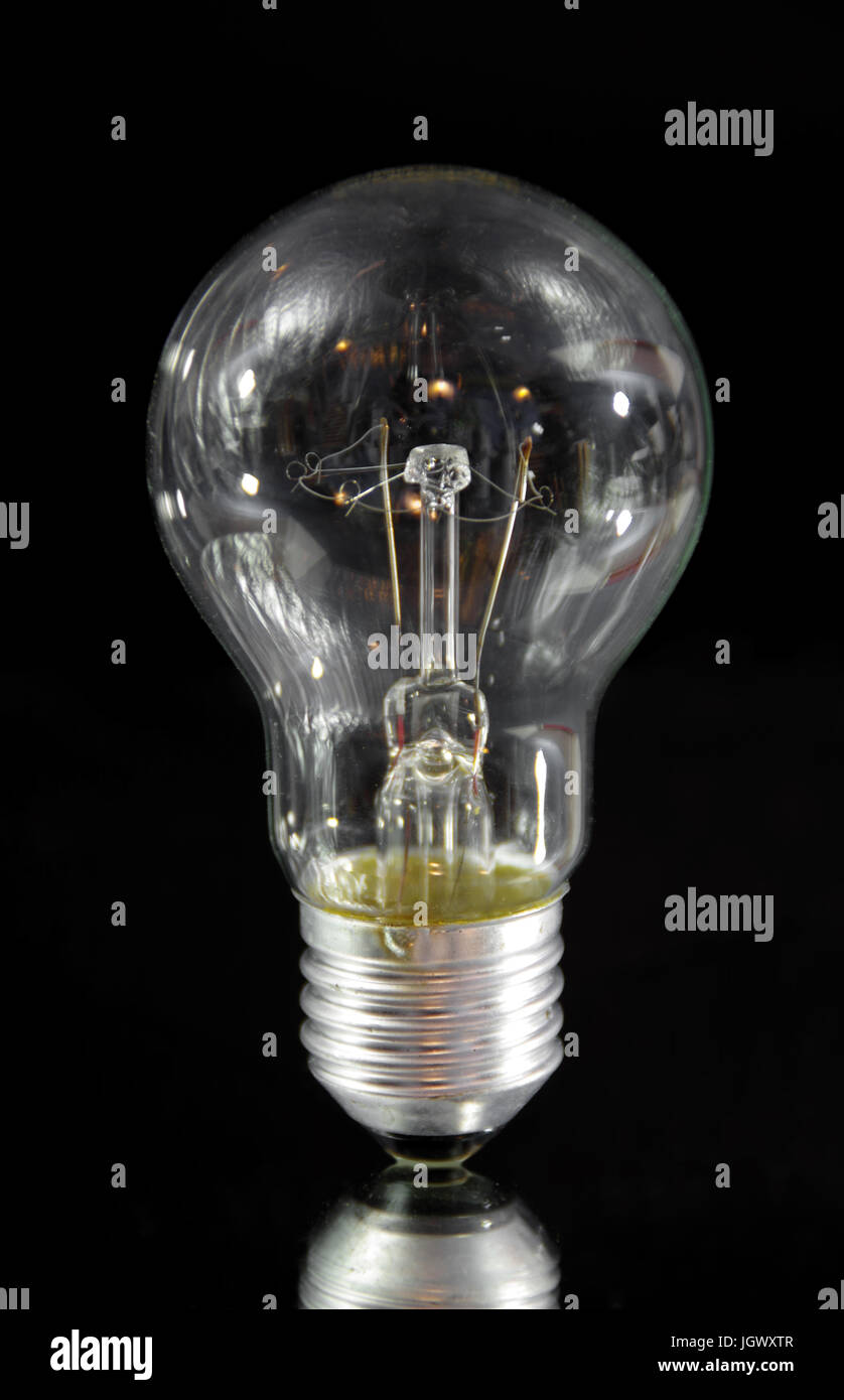 Classic electric bulb on black background. Old lightbulb Stock Photo ...