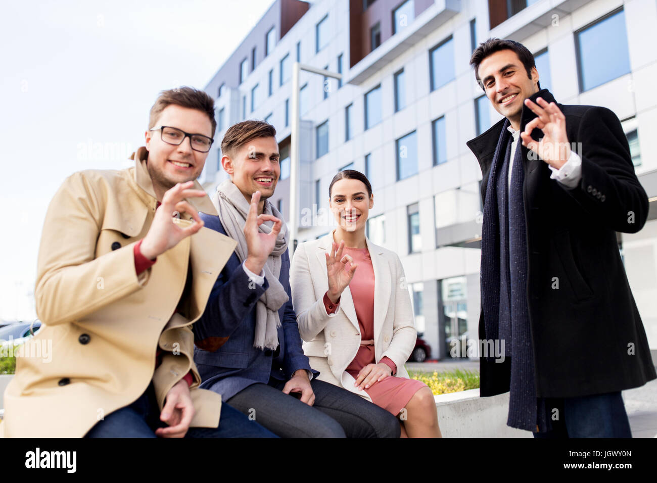 international business team showing ok hand sign Stock Photo - Alamy