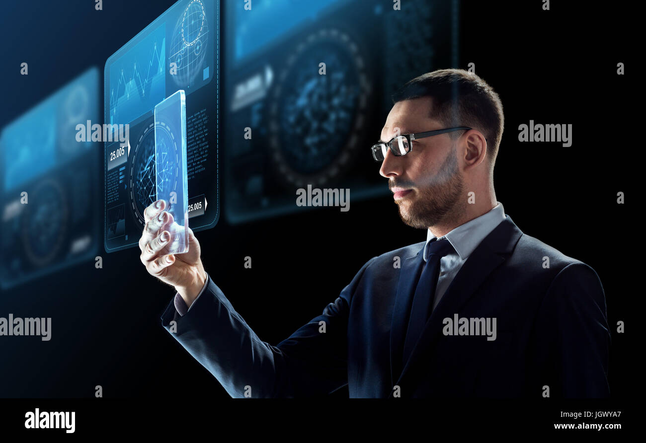 businessman with tablet pc and virtual screens Stock Photo - Alamy