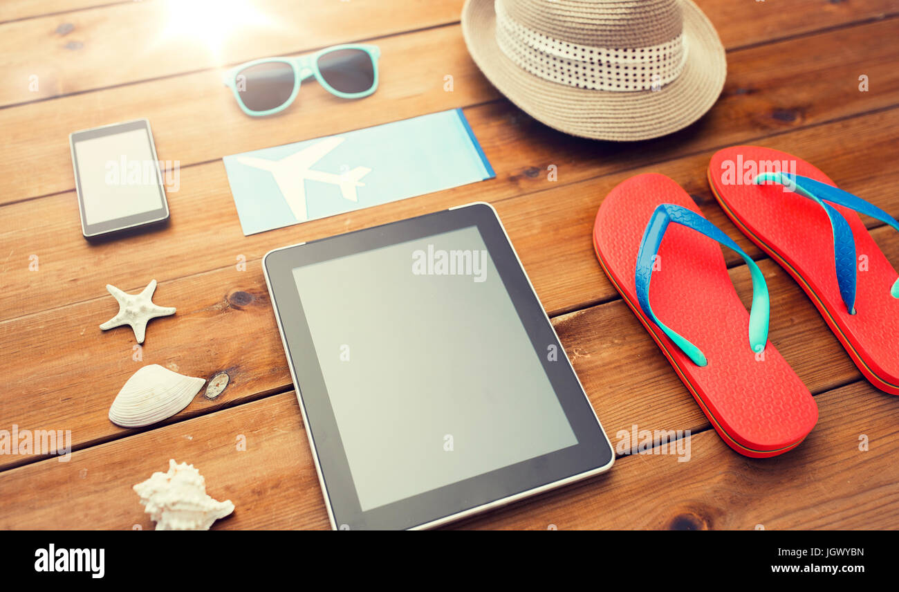 close up of tablet pc and travel stuff Stock Photo - Alamy