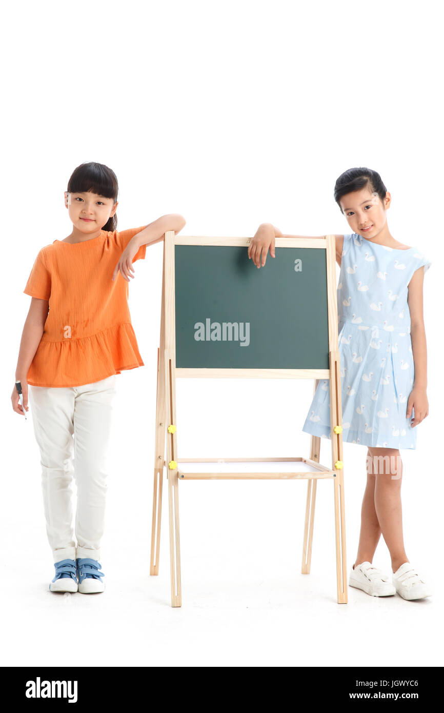 Two school girls with drawing board Stock Photo - Alamy