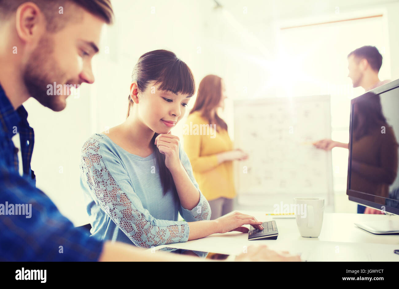 creative team with blueprint at office Stock Photo - Alamy