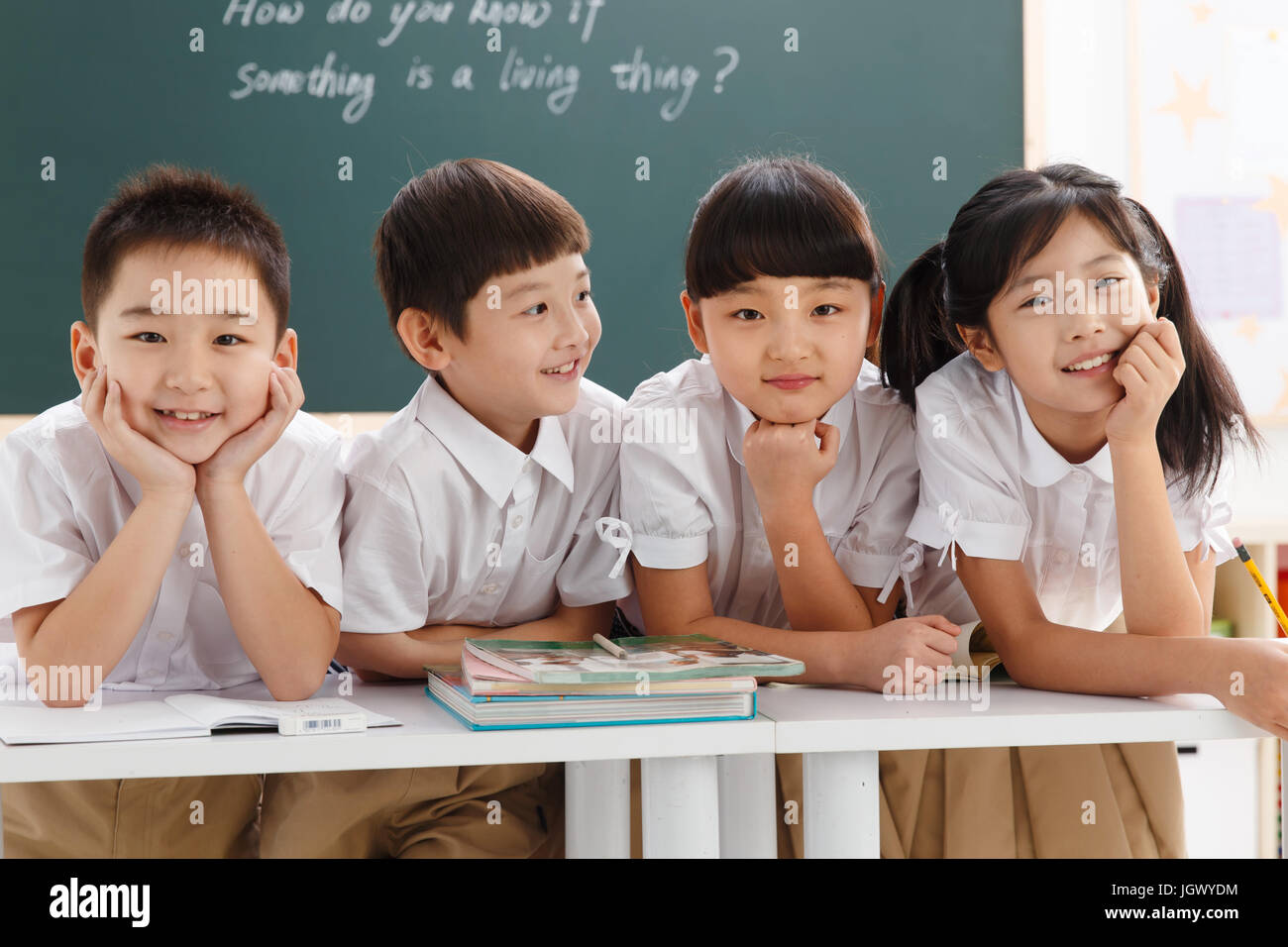 The children are lying on the table in the classroom Stock Photo - Alamy