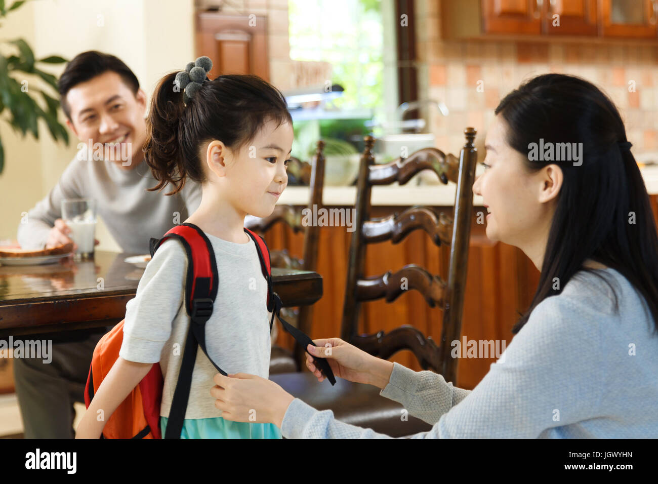 Little girl with her parents at home Stock Photo - Alamy