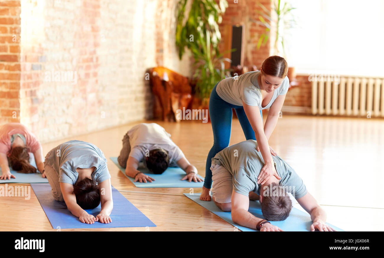 Group people relaxing doing yoga hi-res stock photography and images ...
