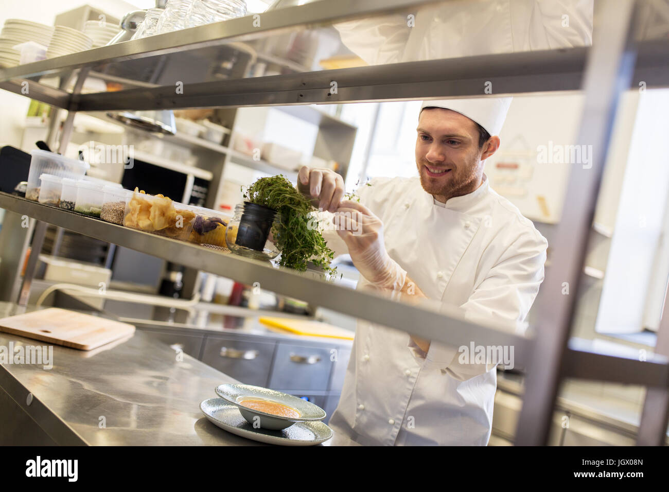 happy male chef cooking at restaurant kitchen Stock Photo - Alamy