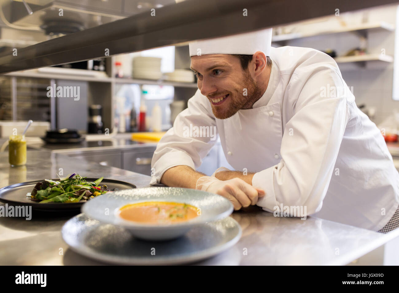 happy male chef cooking food at restaurant kitchen Stock Photo - Alamy