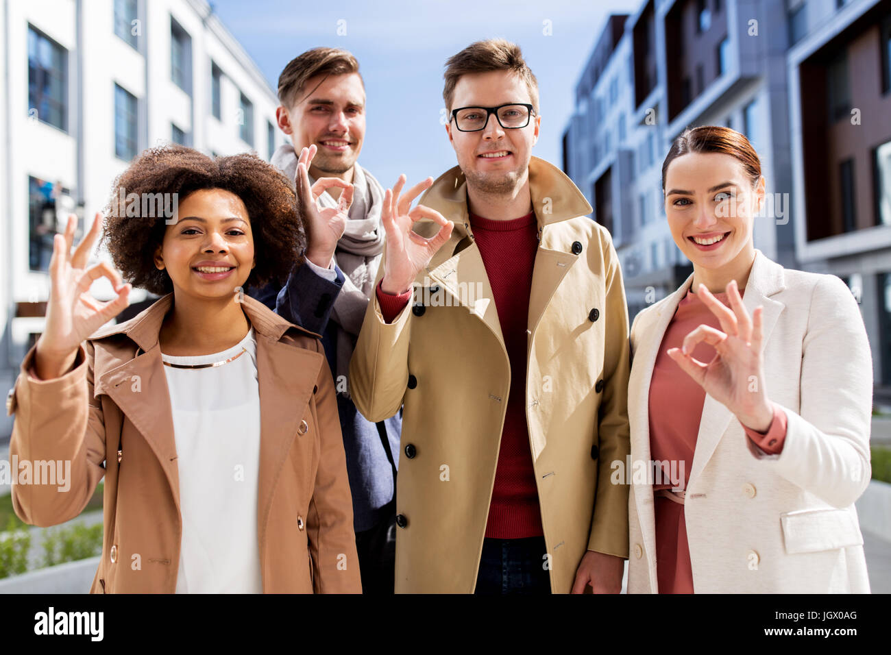 international business team showing ok hand sign Stock Photo - Alamy