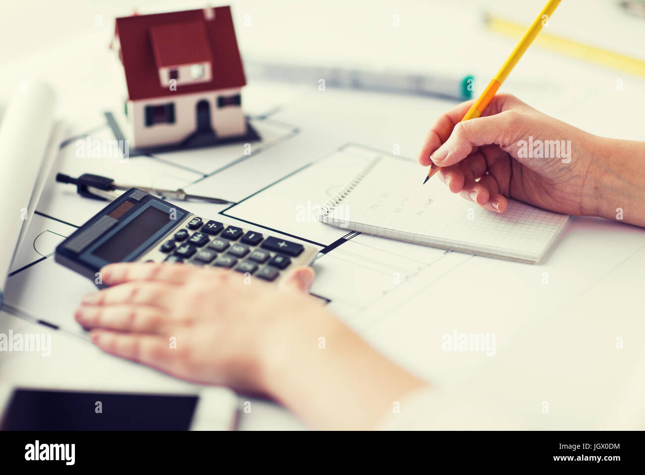 close up of hand on blueprint writing to notebook Stock Photo - Alamy