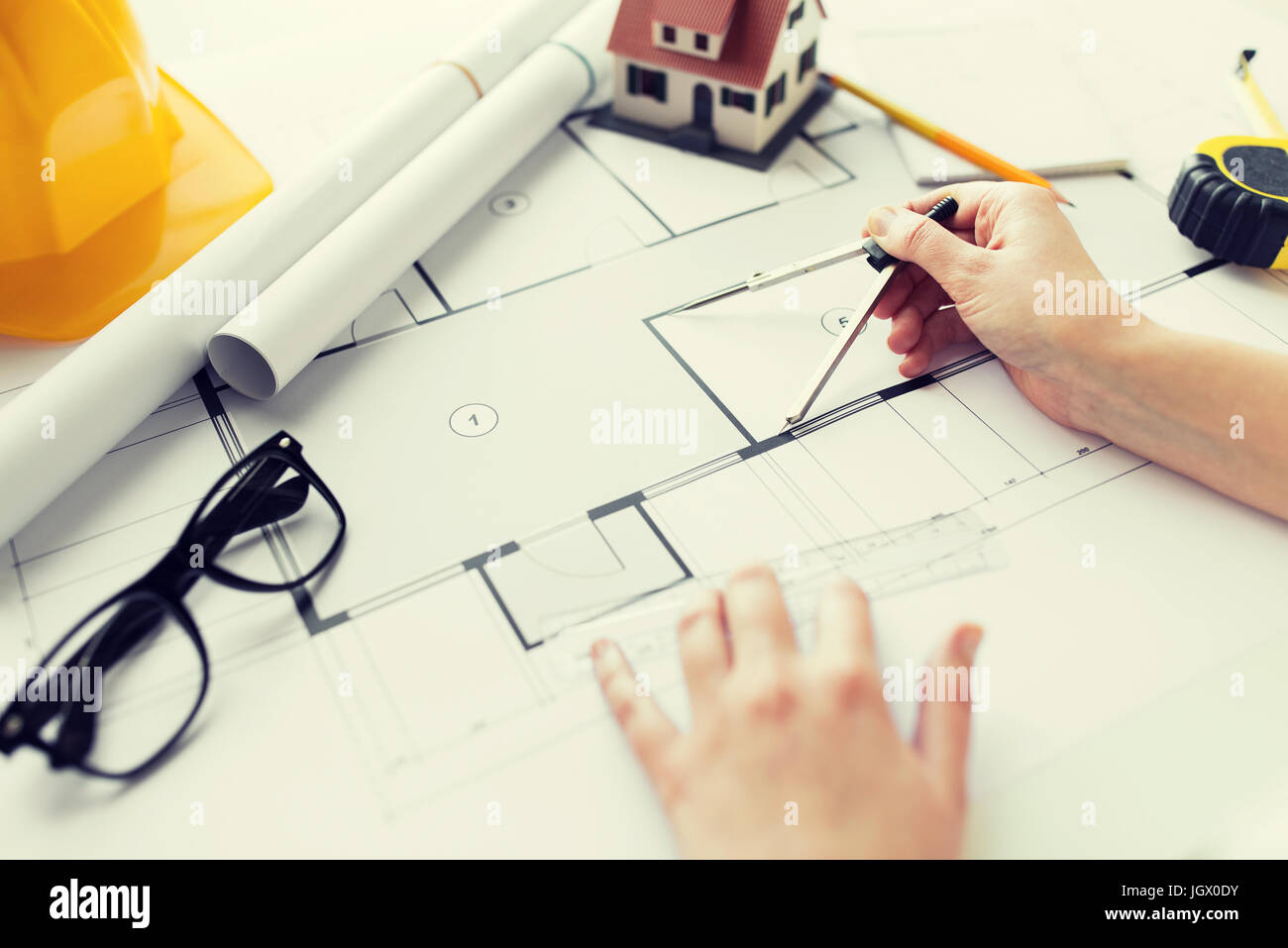 close up of hands with compass measuring blueprint Stock Photo - Alamy