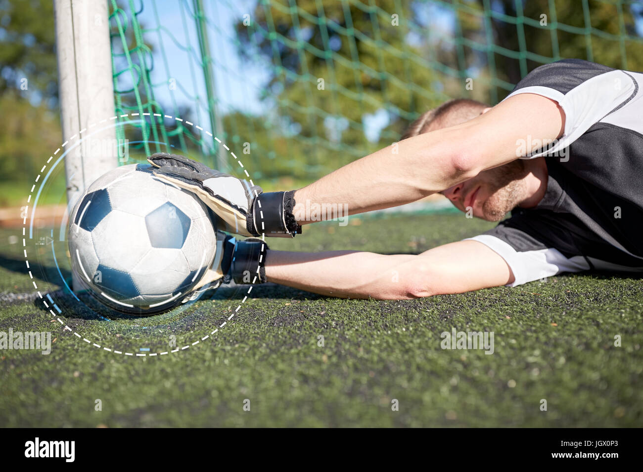 goalkeeper with ball at football goal on field Stock Photo - Alamy