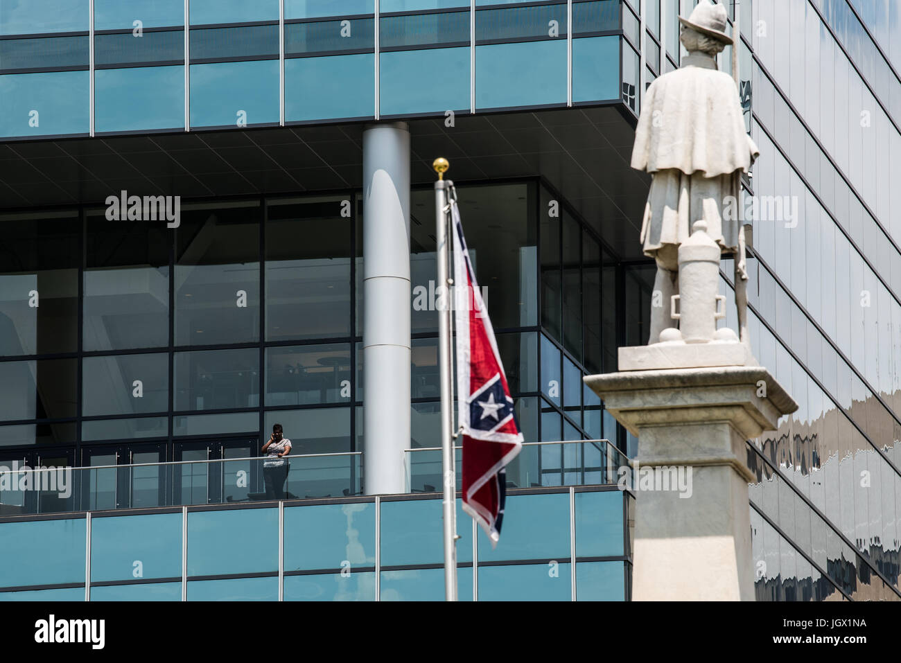 Colombia, South Carolina, USA. 10th Jul, 2017. A woman looks on from ...