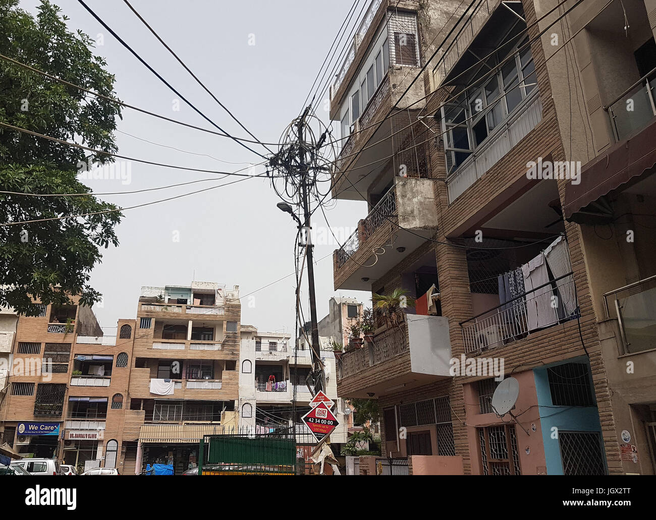 New Dehli, India. 5th July, 2017. A power pole with completely tangled ...