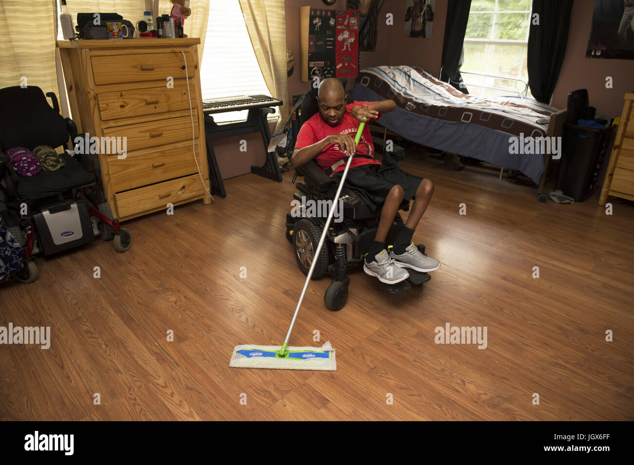 Dalton, GA, USA. 30th June, 2017. Lance Stephens mops the floor in his ...