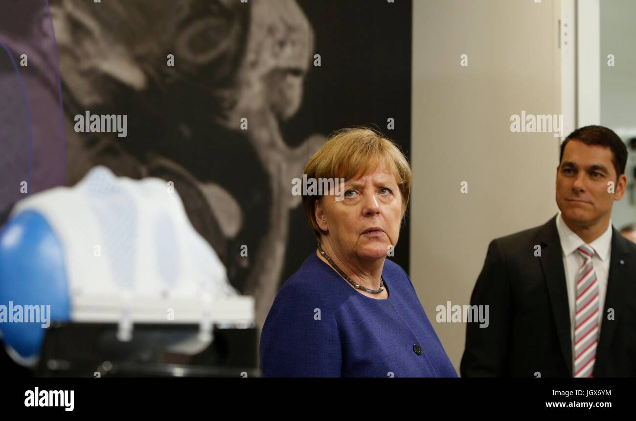 Munich, Germany. 11th July, 2017. German Chancellor Angela Merkel (C ...