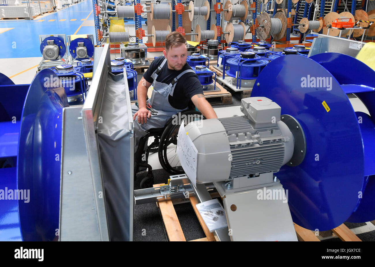 Employee Daniel Schlesinger at work at a workspace for motor terminals ...