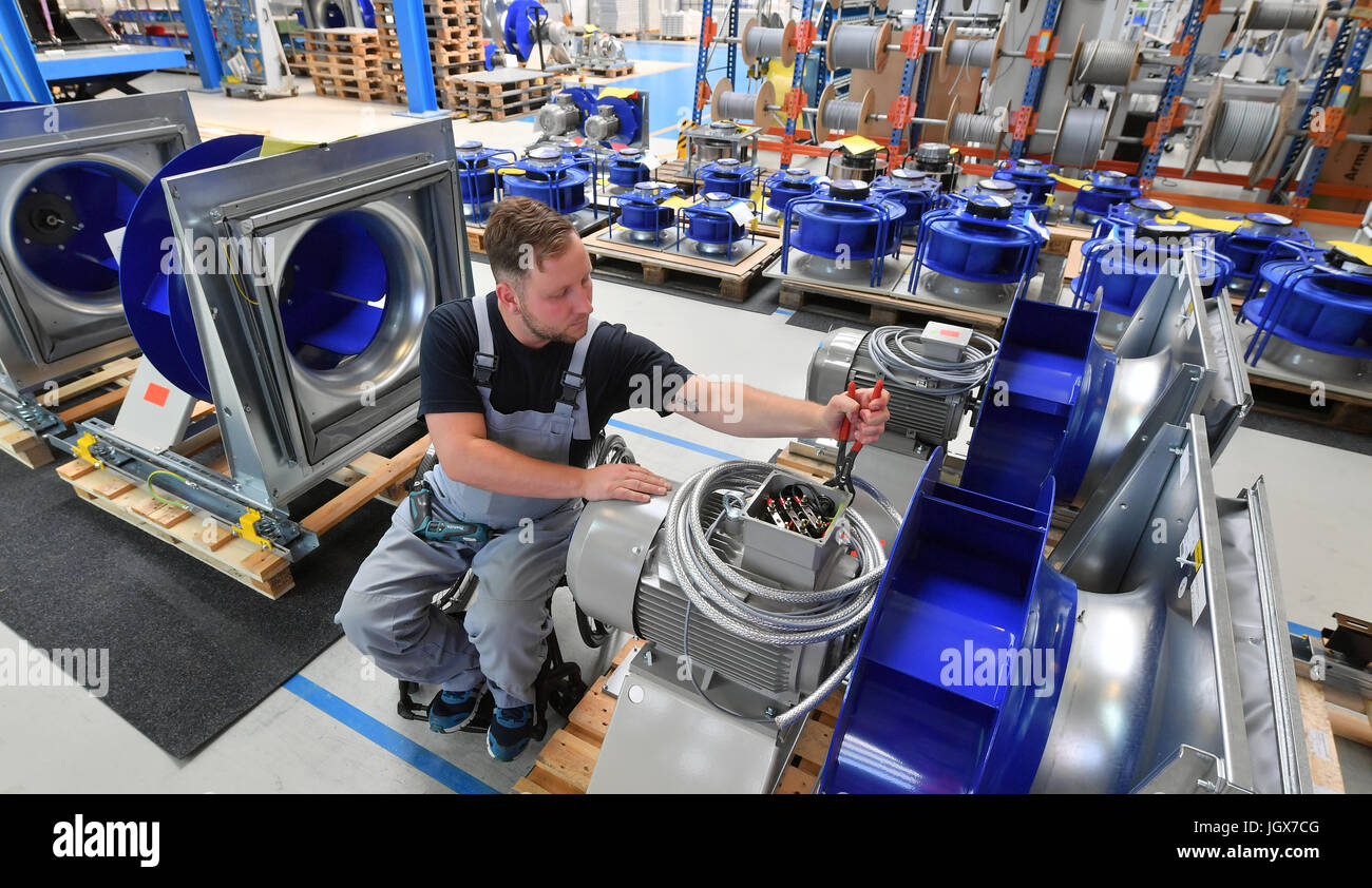 Employee Daniel Schlesinger at work at a workspace for motor terminals ...