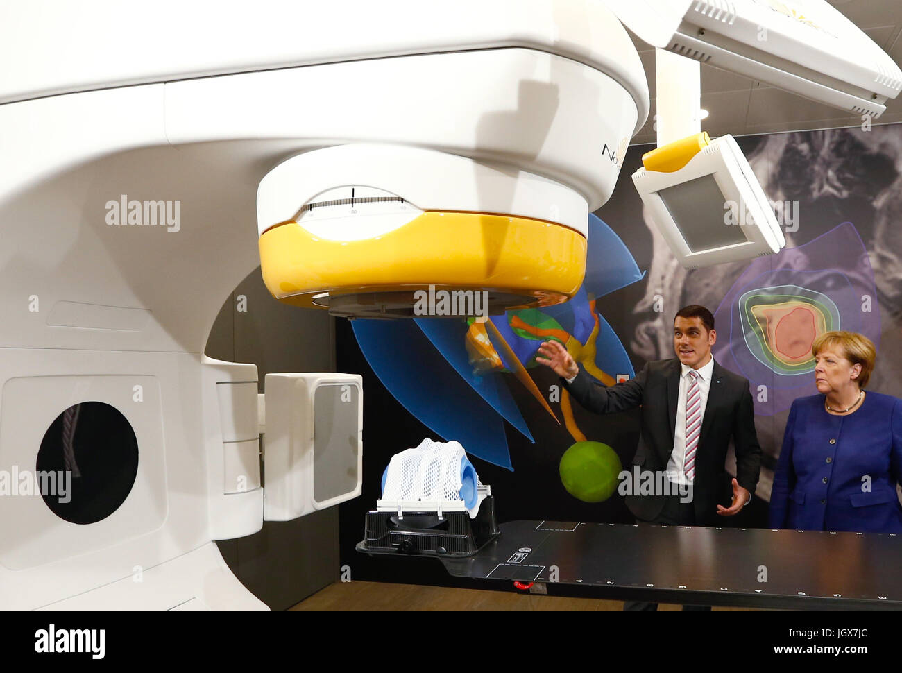 Munich, Germany. 11th July, 2017. German Chancellor Angela Merkel (R) and Stefan Vilsmeier ...