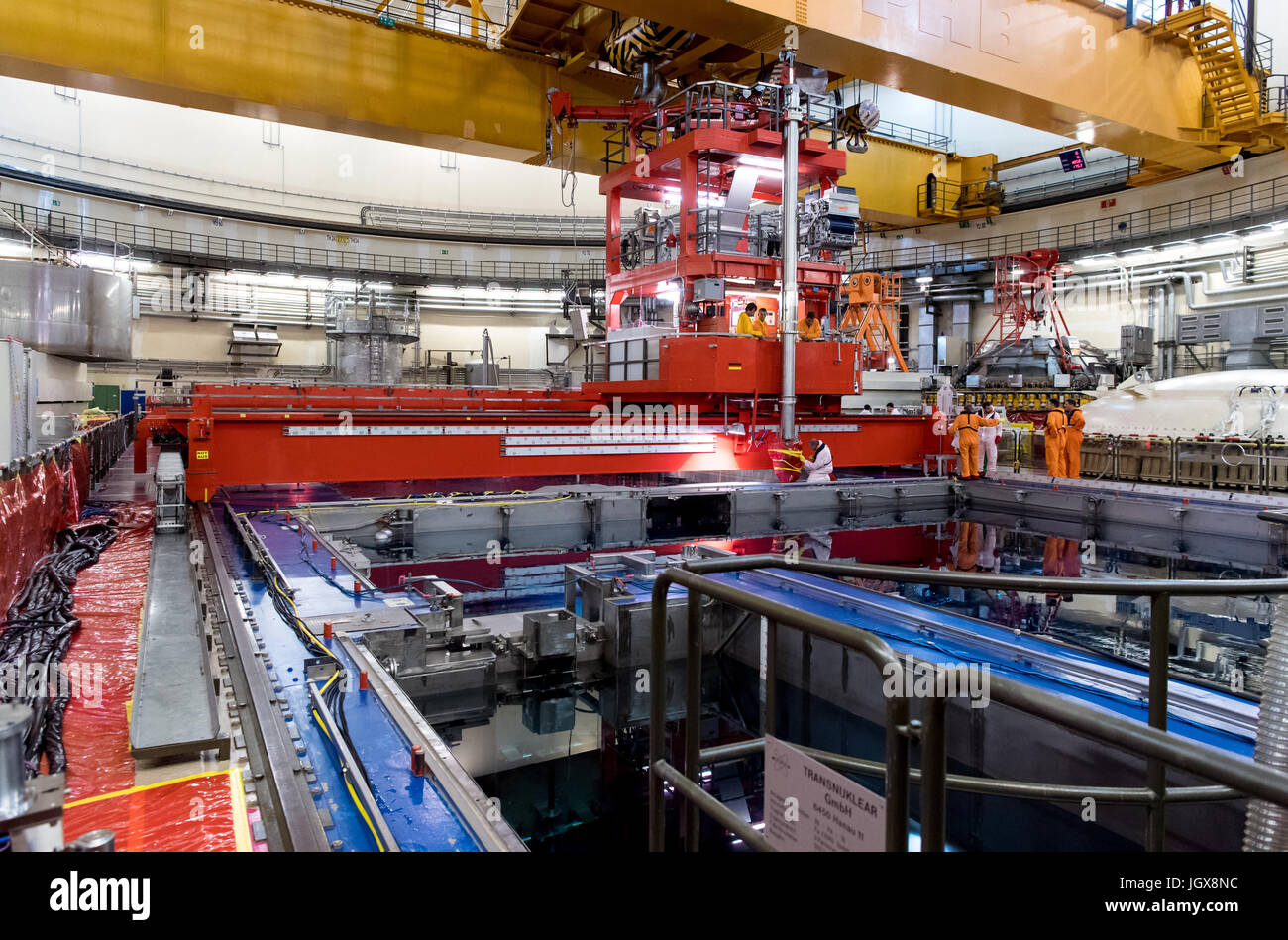 Workers in protective suits carry out inspection work in the reactor ...