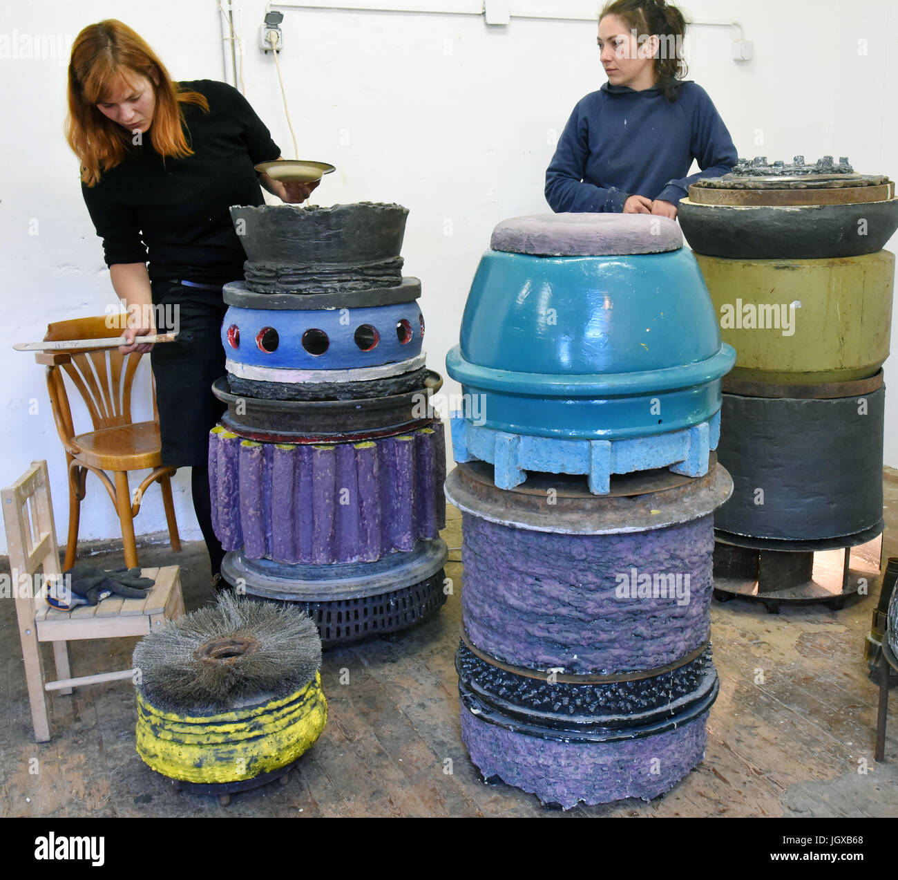 Student of ceramics and artist Sarah Bartmann (l) with installation ...