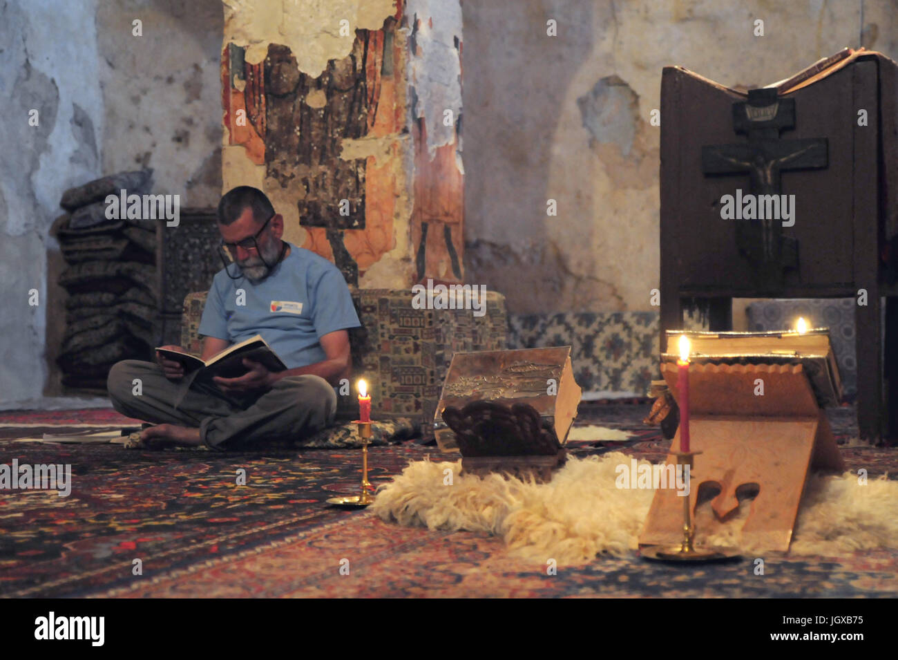 A monk prays inside the monastery church of Saint Moses the Abyssinian ...