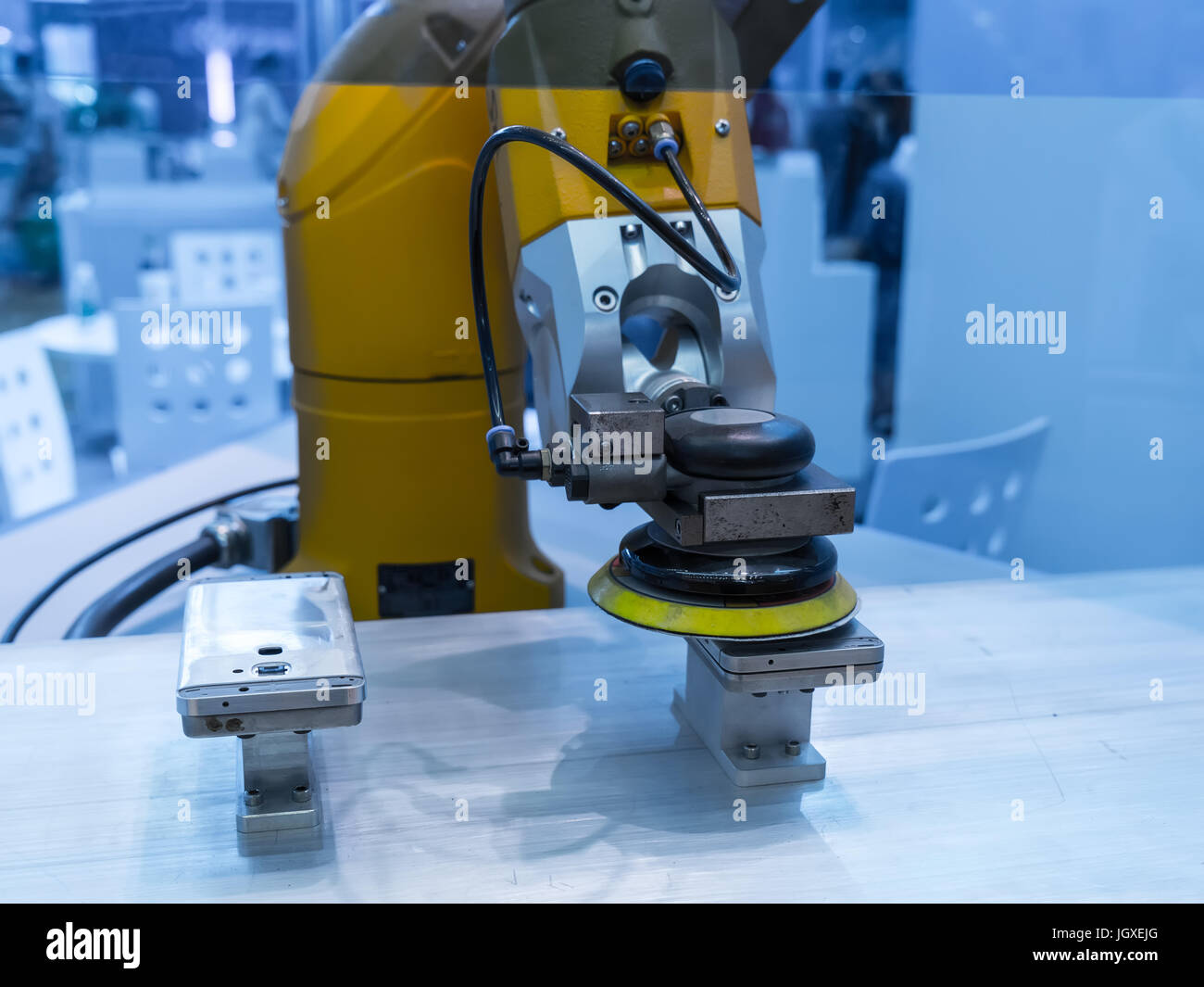 Industrial robot working in phone factory Stock Photo - Alamy